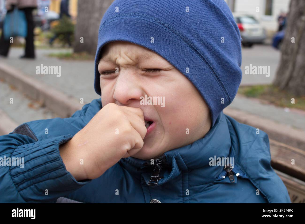 the emotion of the boy who bites hard dough biscuits Stock Photo - Alamy