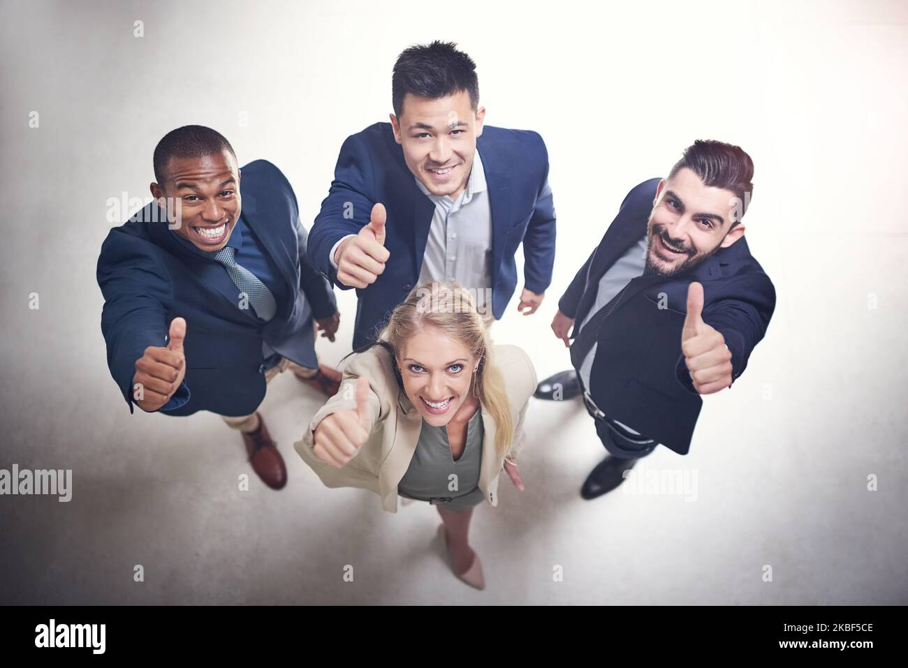 We say yes to success. High angle shot of a team of happy colleagues ...