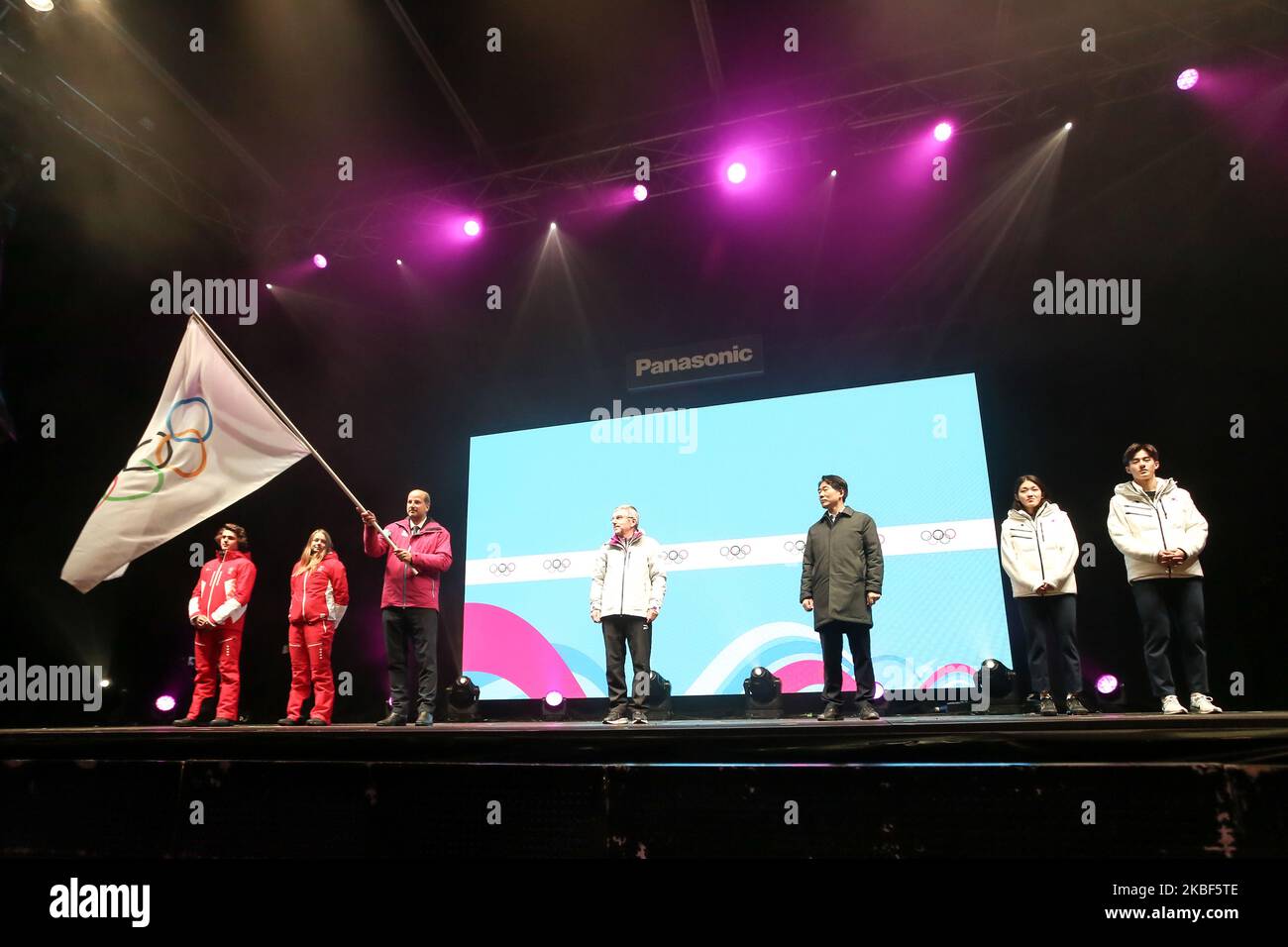 A ceremony of handing over the Olympic Flag assisted by International ...