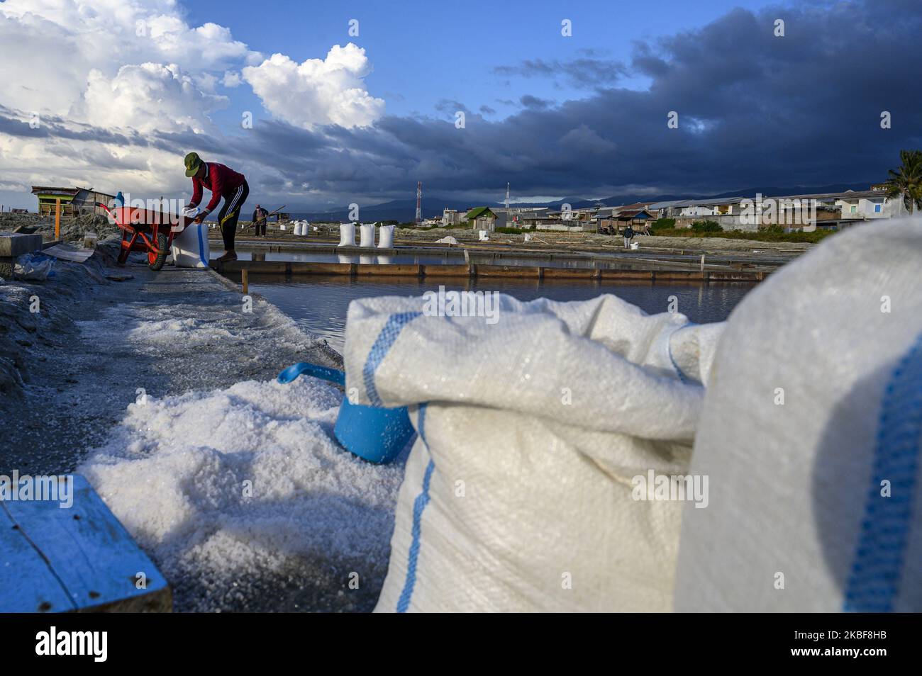 Farmers transport their salt that has just been harvested in Palu ...
