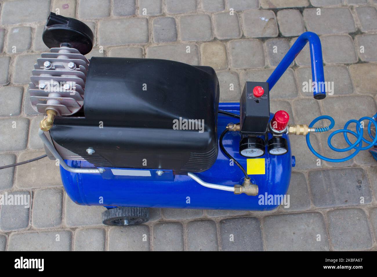 work in the air compressor blue in the yard Stock Photo - Alamy