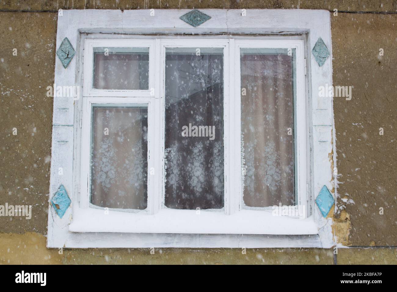 The Ukrainian white wooden window is outwardly old Stock Photo - Alamy