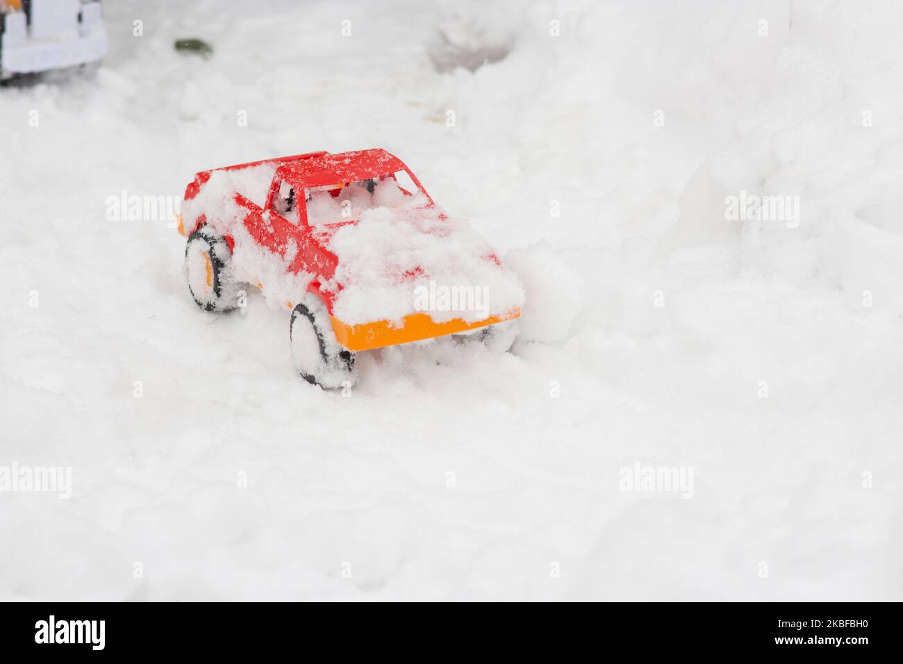 Abandoned toy car in the snow is covered with snow Stock Photo - Alamy
