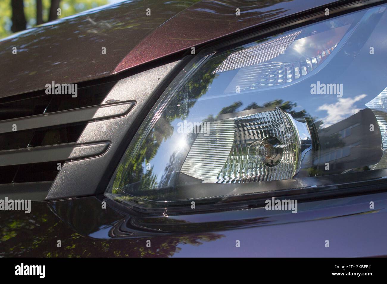 automotive headlight family car with sunlight beautiful Stock Photo - Alamy