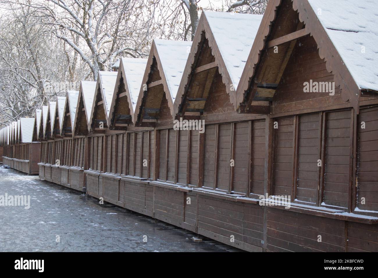 Empty at the Christmas Fair and closed wooden booths Stock Photo - Alamy