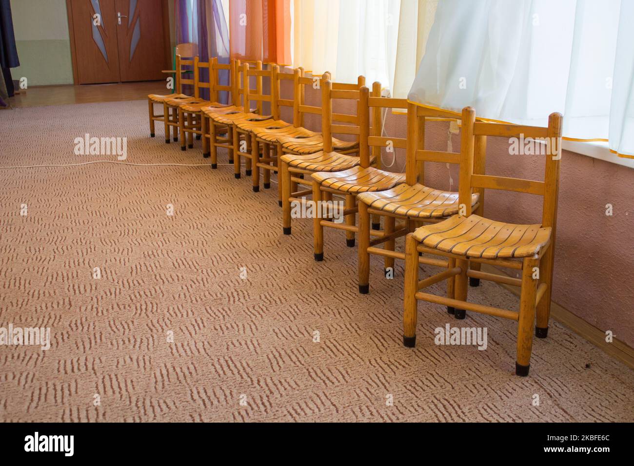 kindergarten empty wooden chairs standing in a row Stock Photo - Alamy