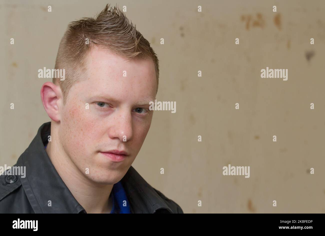 young man looking forward with mohawk type hair style, isolated from ...