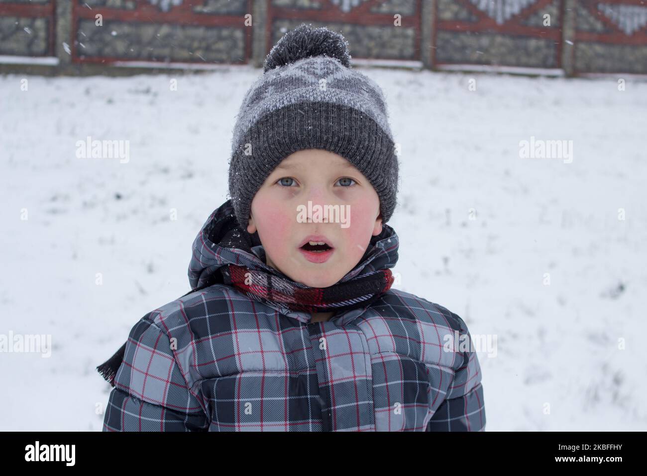 Little Boy Is Surprised To Watch His Mouth Open In The Winter Stock 8518