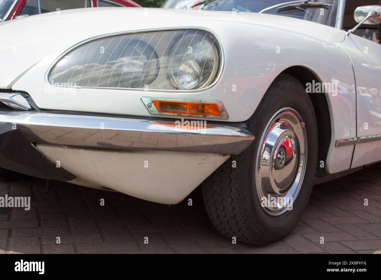beautiful white vintage car with a large headlight Stock Photo - Alamy