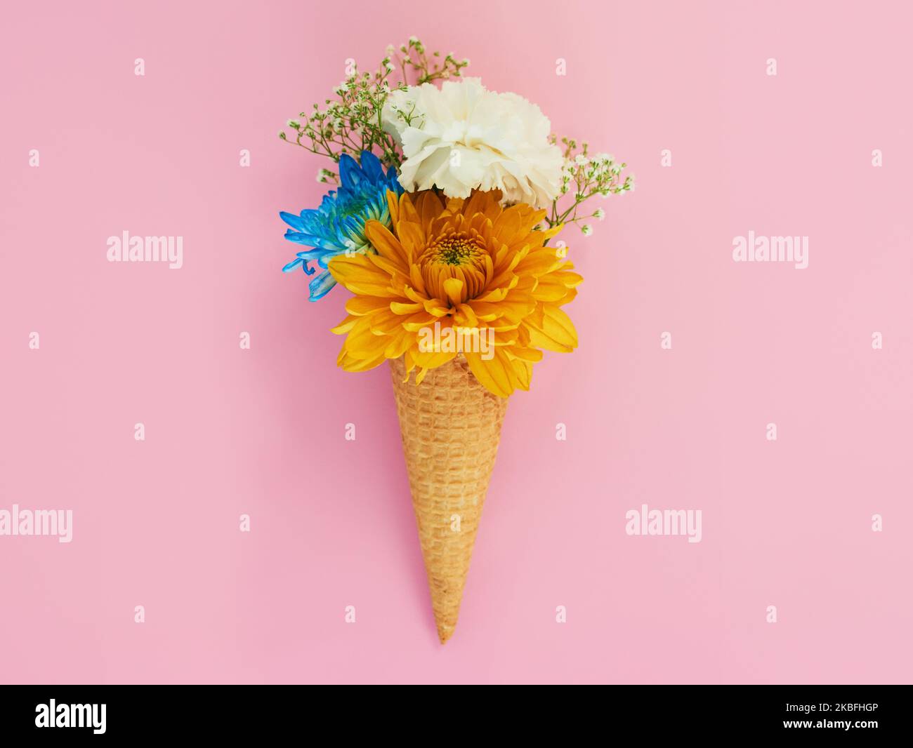 Be creative with your centerpieces. a cone stuffed with flowers against ...