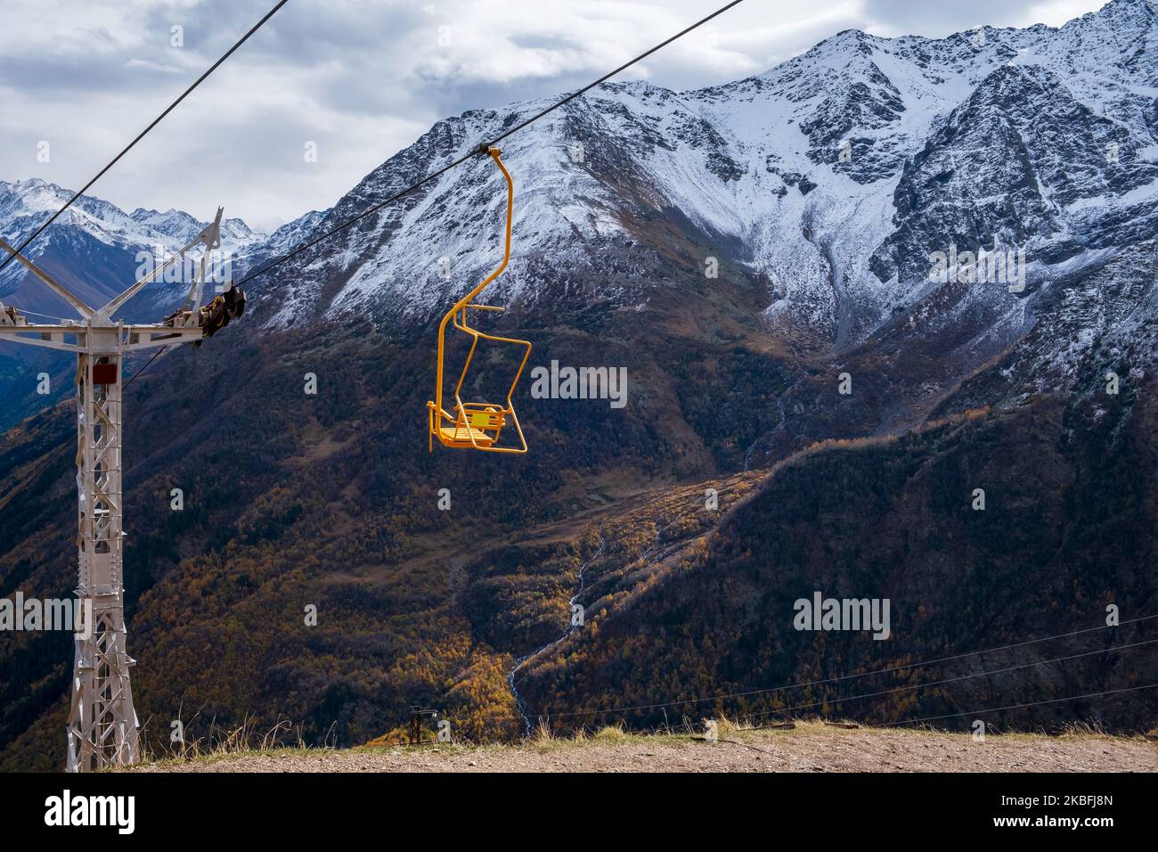 Mountain landscape with a moving chair of a single-seat cable car Stock ...