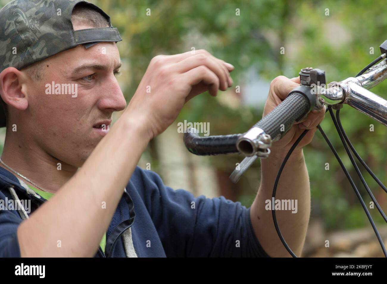 bicycle service in nature, repair of brakes on a bicycle Stock Photo ...