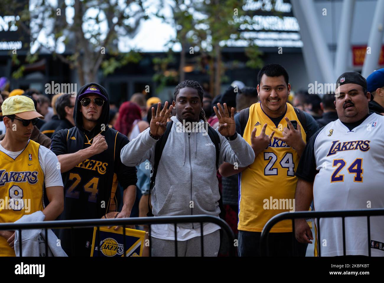 LA Lakers fans sign the number ''8'' for Kobe Bryant at a memorial in ...