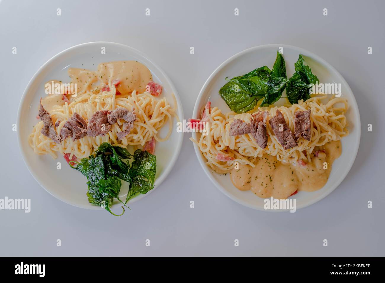 Spaghetti gourmet basil noodle hi-res stock photography and images - Alamy