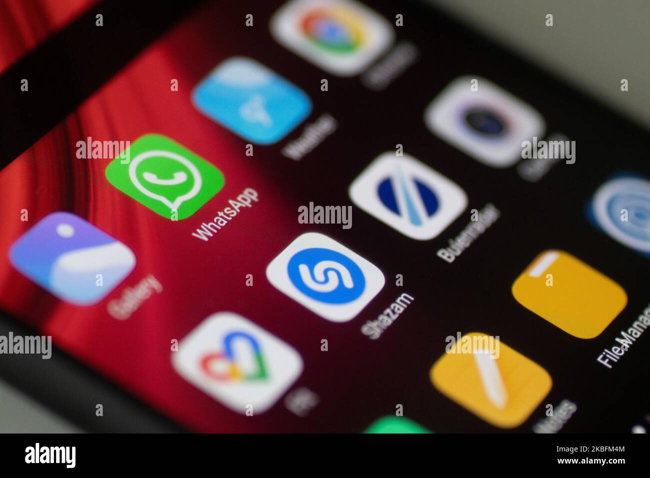 WhatsApp logo displayed on a phone screen, smartphone and keyboard are ...