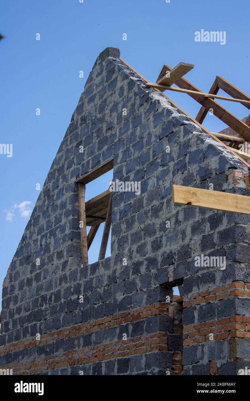 a building Uncompleted construction gray roof rafters Stock Photo - Alamy