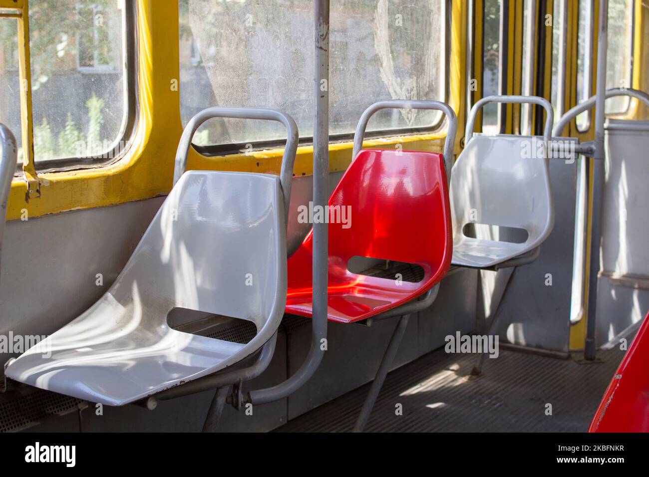 three empty seats in an old tram at the window Stock Photo - Alamy