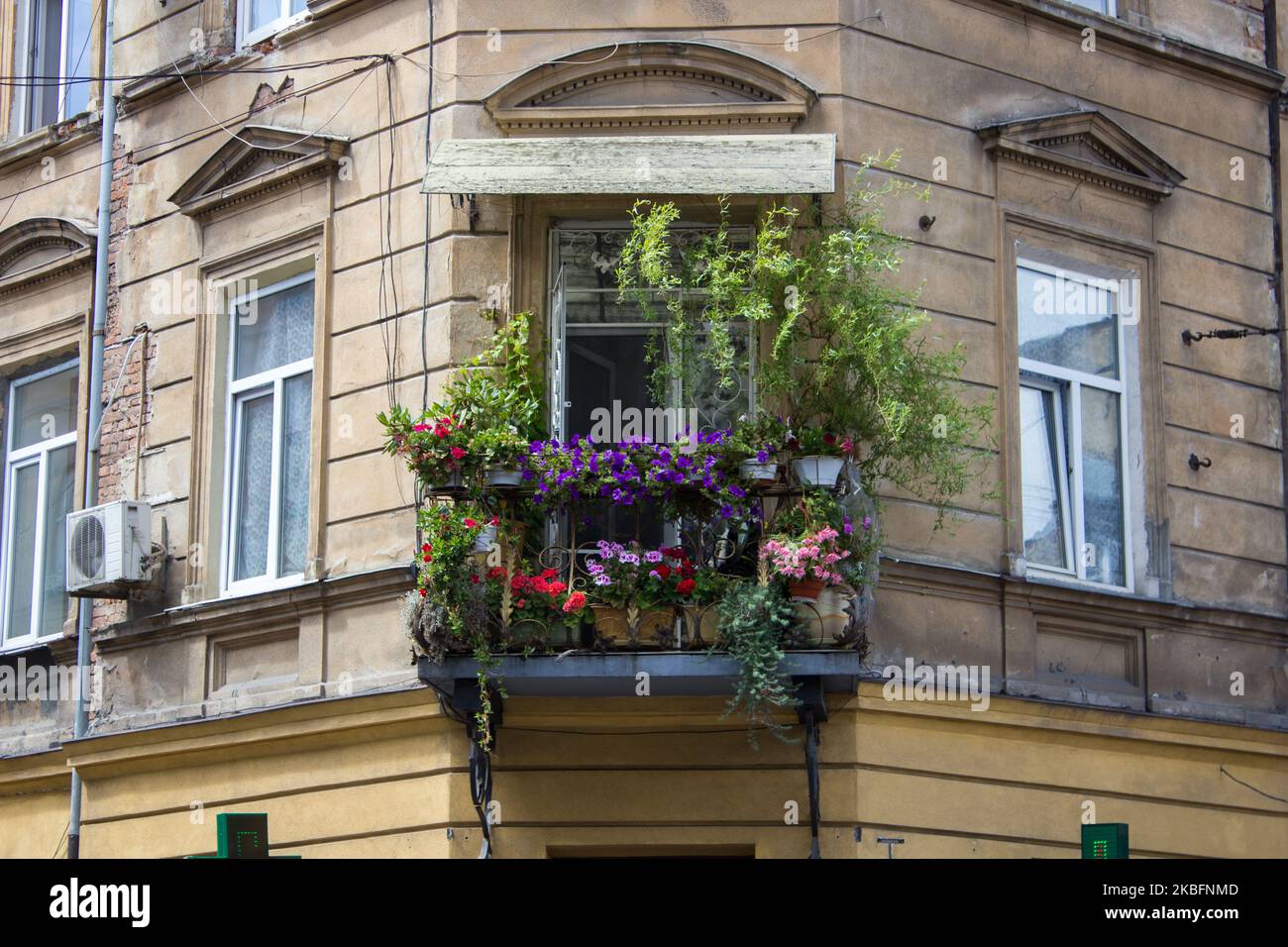 Traditional European Balcony with colorful flowers and flowerpots Stock ...