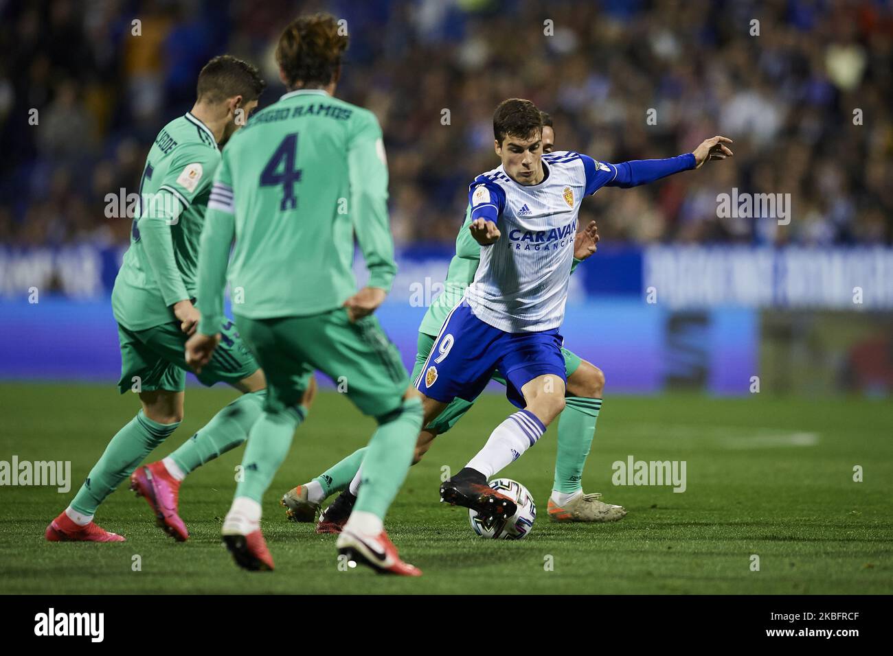 Alberto Soro of Real Zaragoza surrounded by Madrid players during the ...
