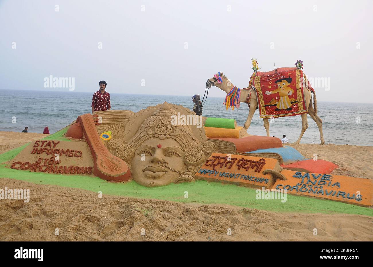 Sand sculpture of goddess Saraswati is seen at the Bay of Bengal Sea's ...