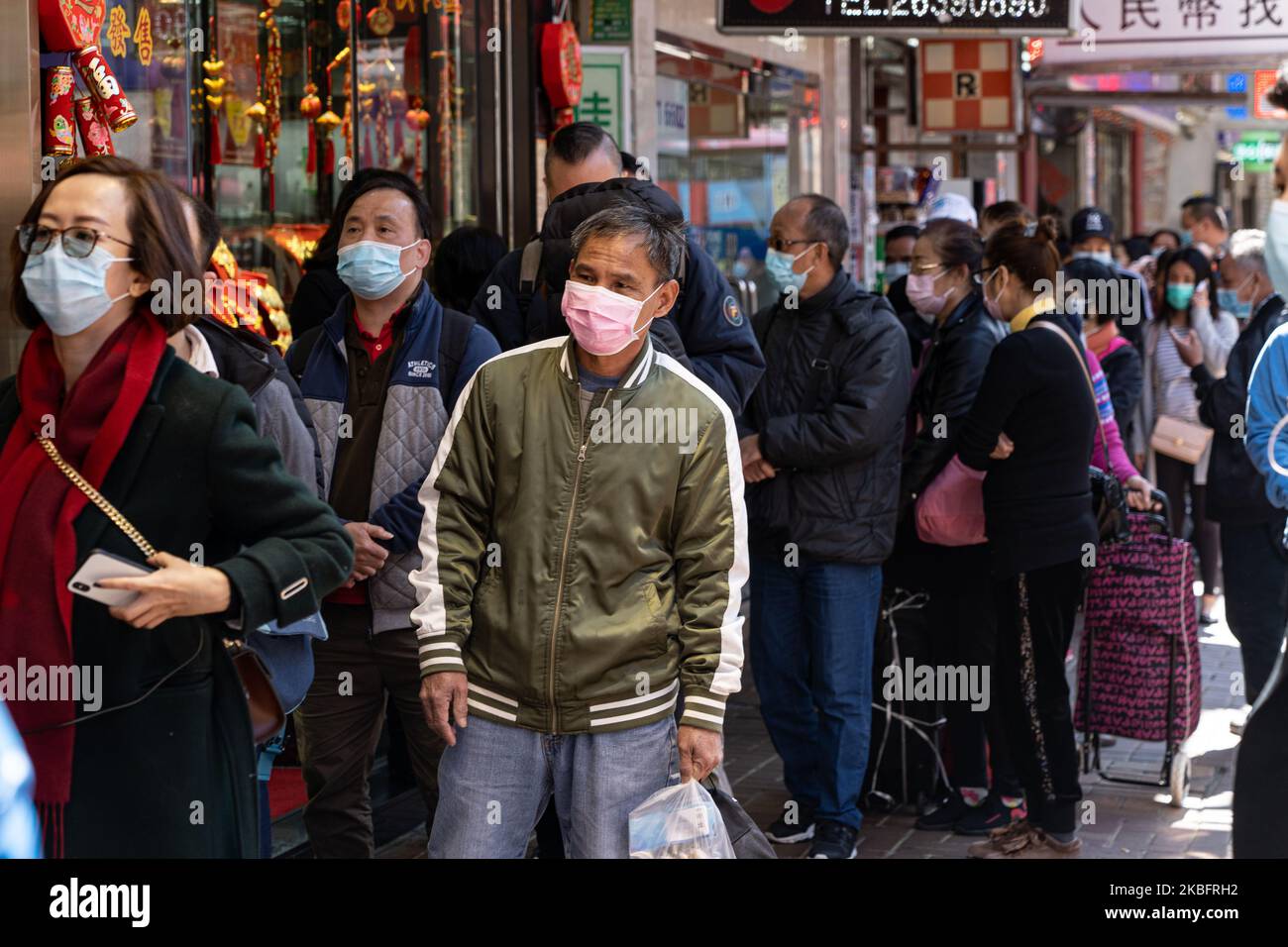 People wearing masks on the street in Hong Kong on January 30, 2020 ...