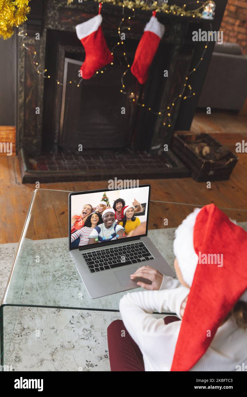 Caucasian woman having christmas video call with diverse people Stock ...