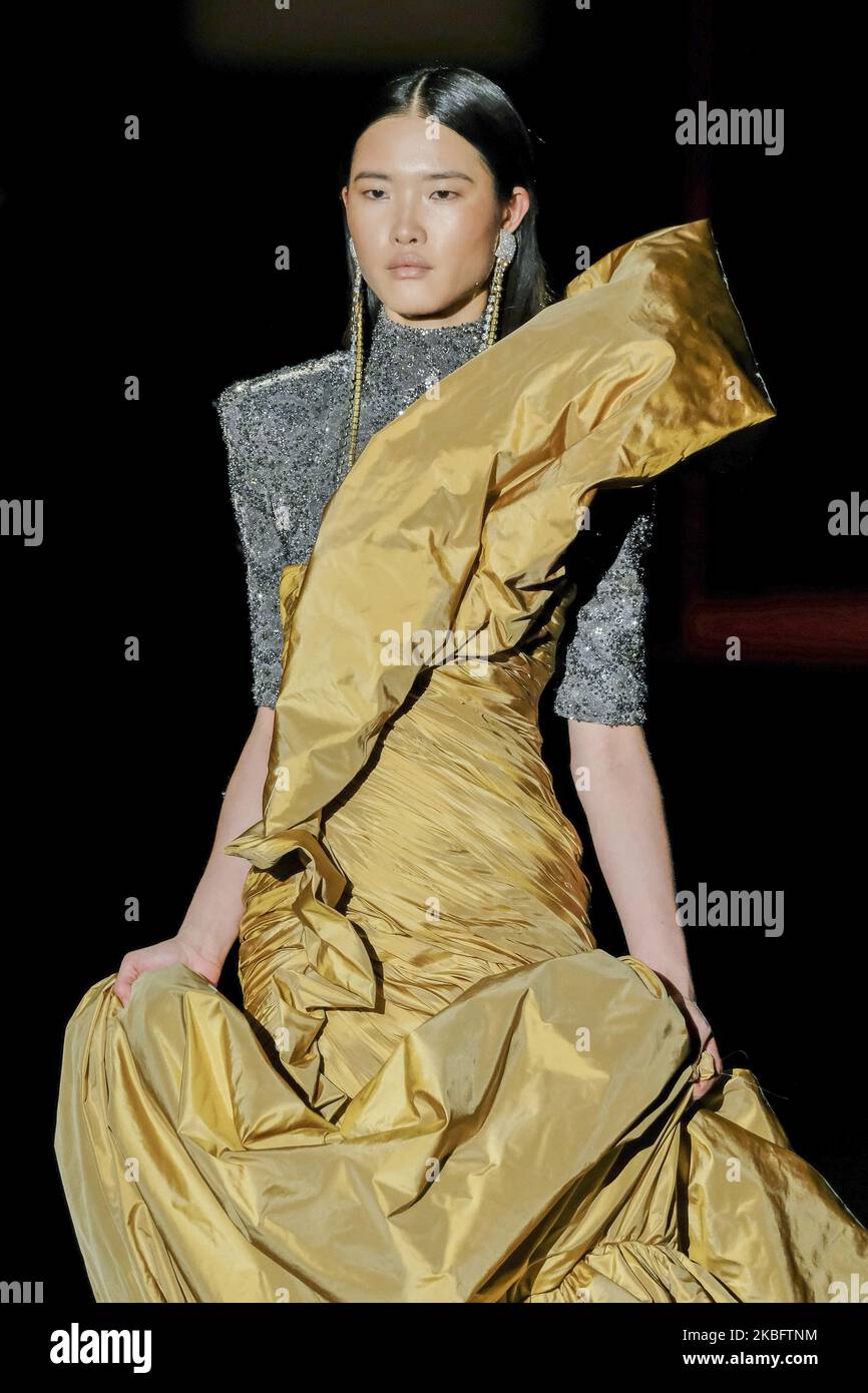 A model walks the runway at the FERNANDO CLARO fashion show during ...