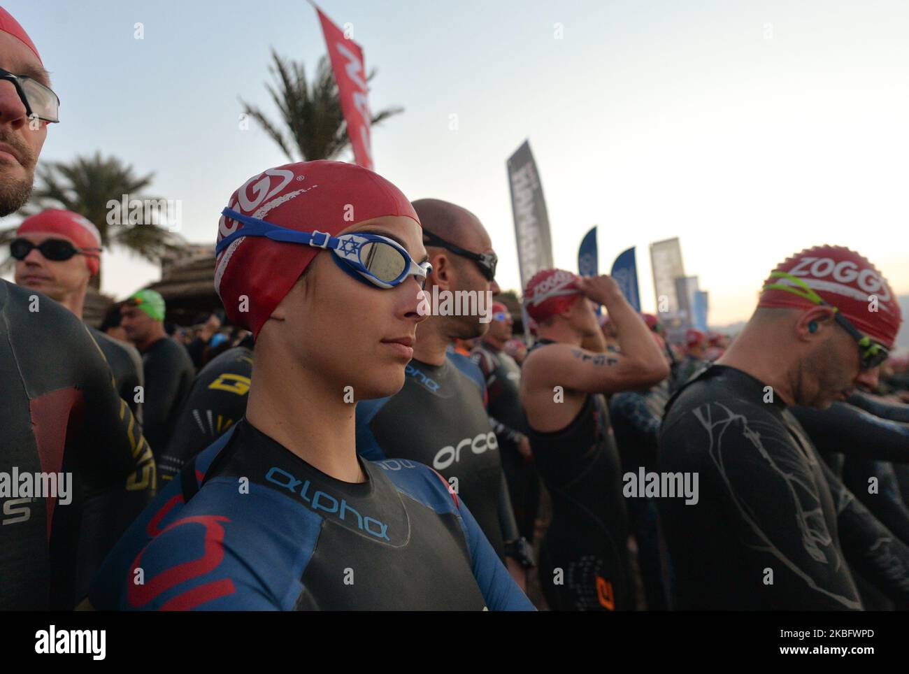 Athletes ready to enter to the Red Sea, at the start of the full ...