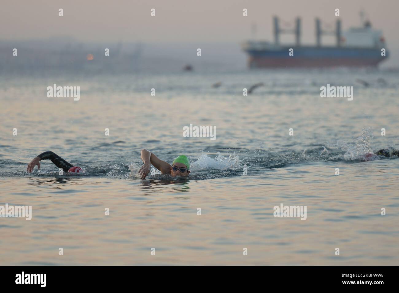 Athletes finishing their swim in the Red Sea during a full Ironman ...