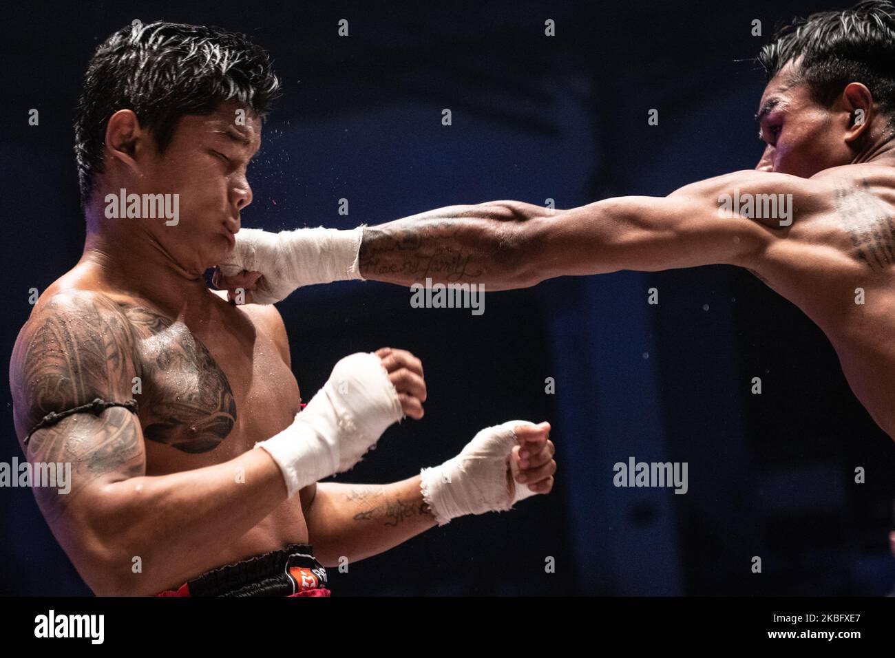 Em Sothy of Cambodia (R) punches Hein Tun Aung of Myanmar (L) in their ...
