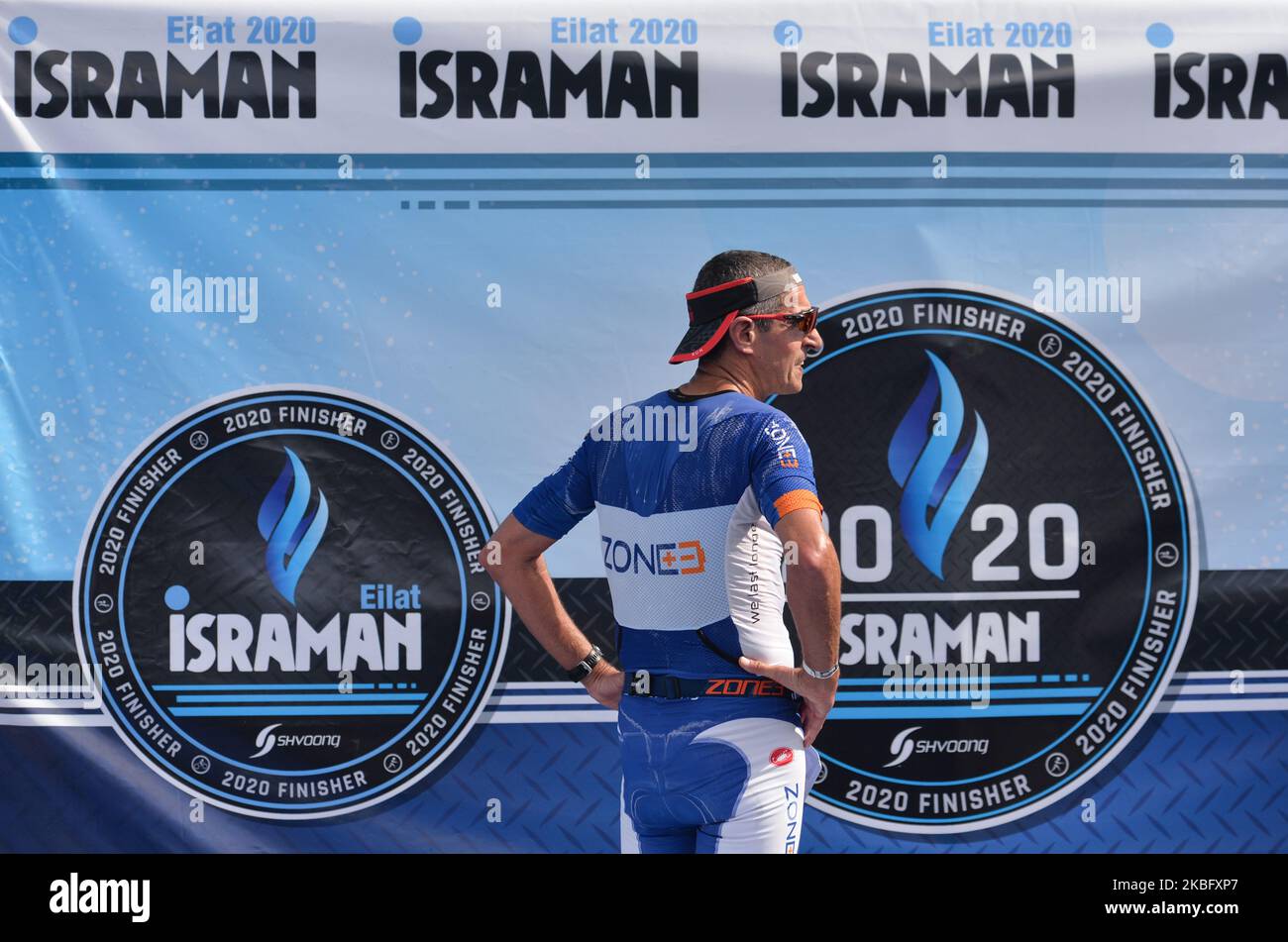 A finisher of a half Ironman Triathlon seen after crossing the finish ...