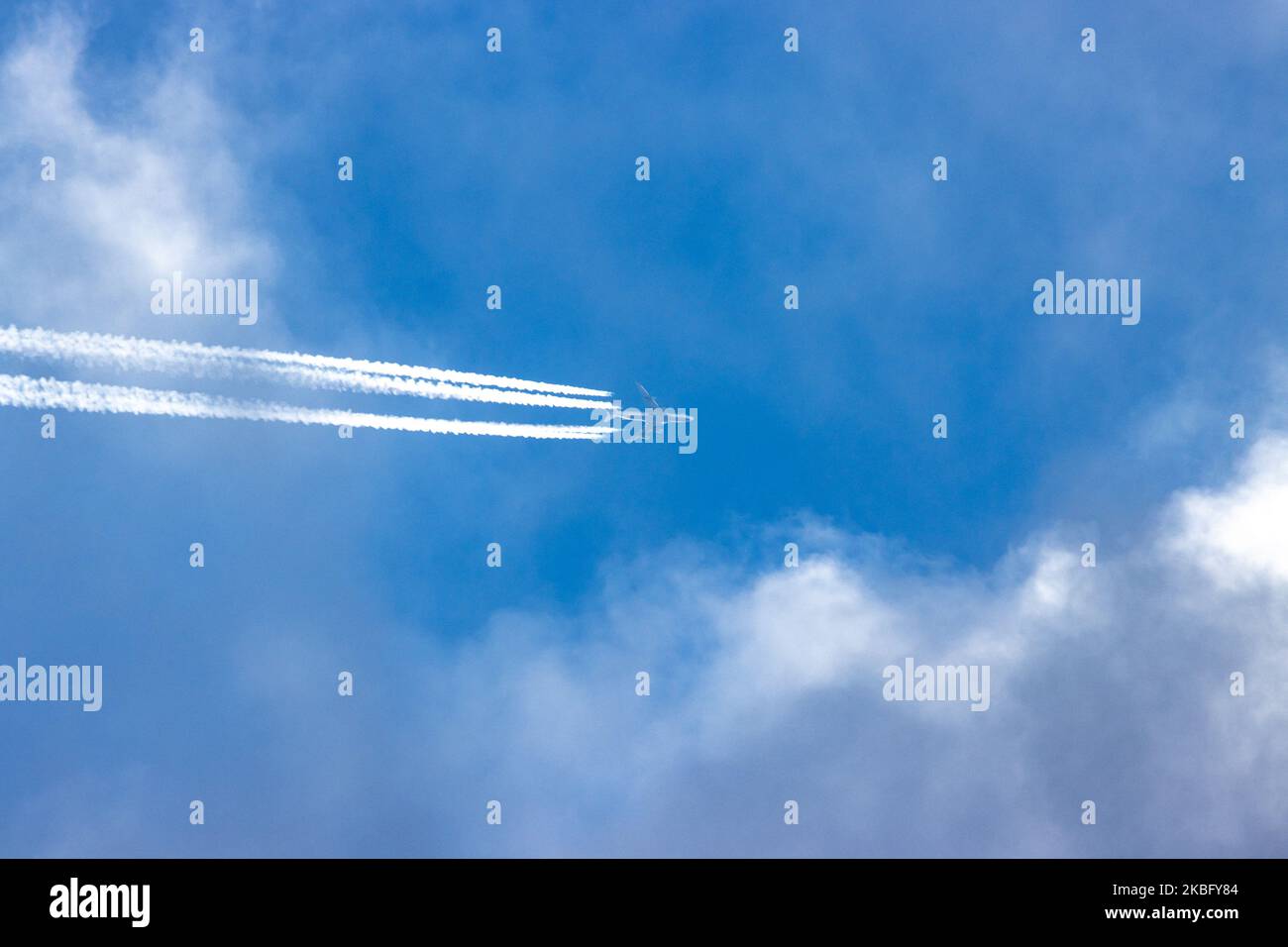 Lufthansa Boeing 747 commercial airplane overfly forming engine exhaust ...
