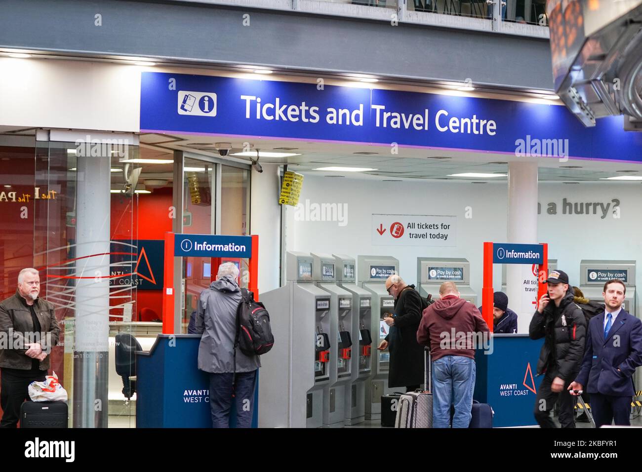 People waiting outside a ticket office to buy ticket at Manchester ...
