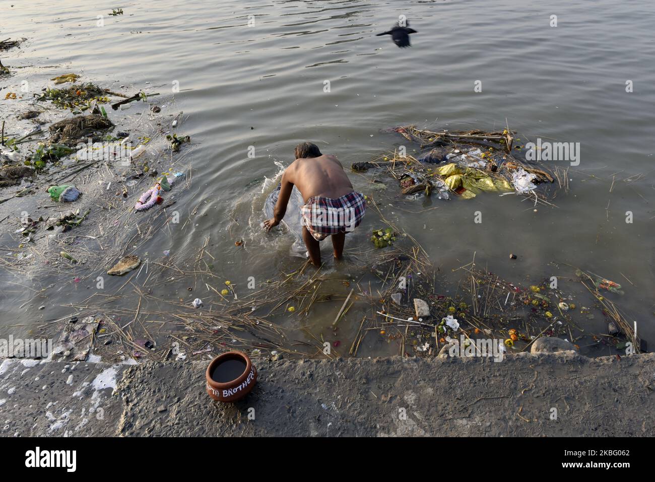 A man baths on a polluted river Ganga in Kolkata, 01 February, 2020 ...