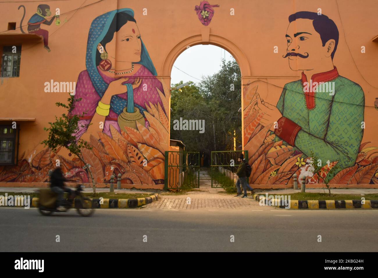 People walk next to a mural in Lodhi Colony, New Delhi on 01 February ...