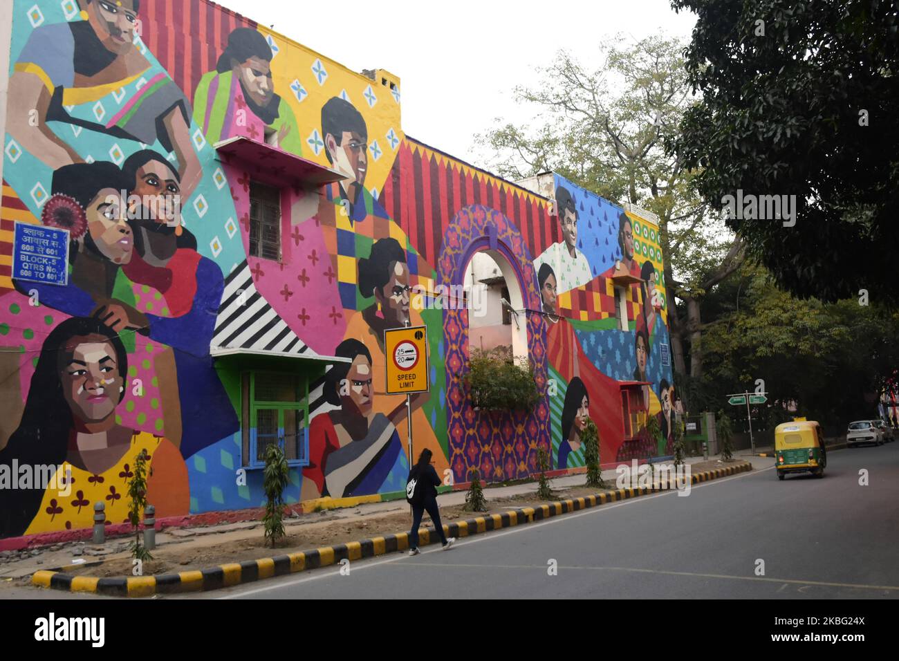 An Indian women walks past a mural in Lodhi Colony, New Delhi on 01 ...