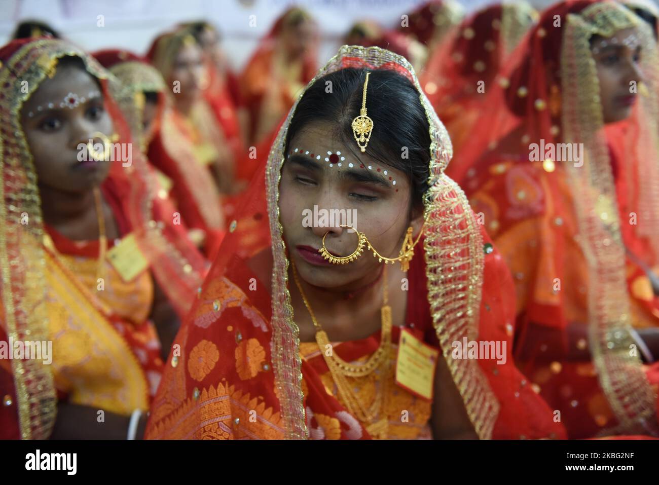A partially blind girl waiting for the wedding ceremony to start during ...