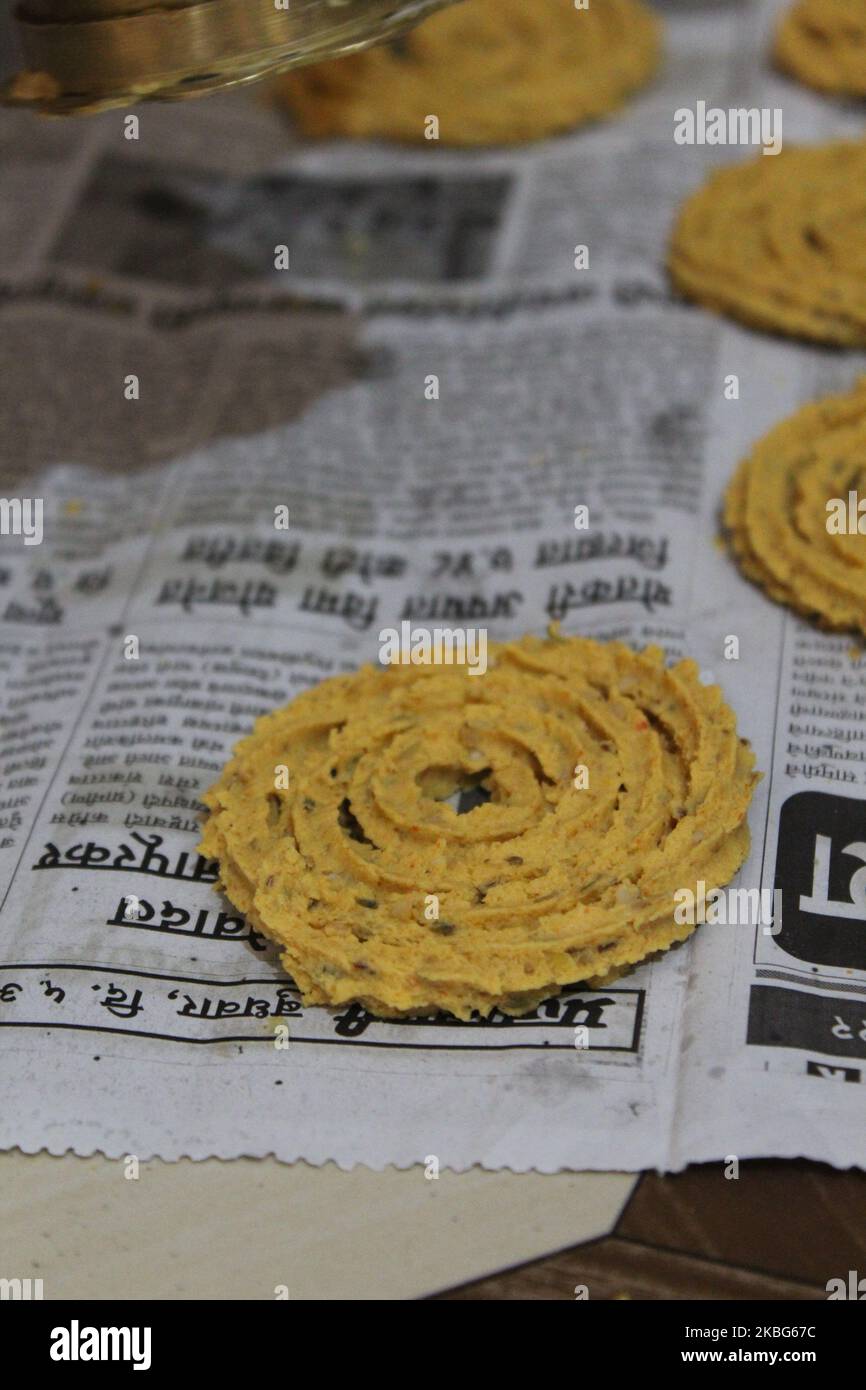 Raw chakali in plate. Indian Traditional Tea Time Snack Chakli, a deep ...