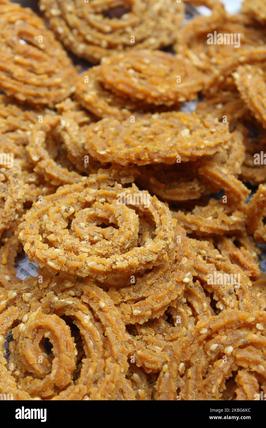 Raw chakali in plate. Indian Traditional Tea Time Snack Chakli, a deep ...