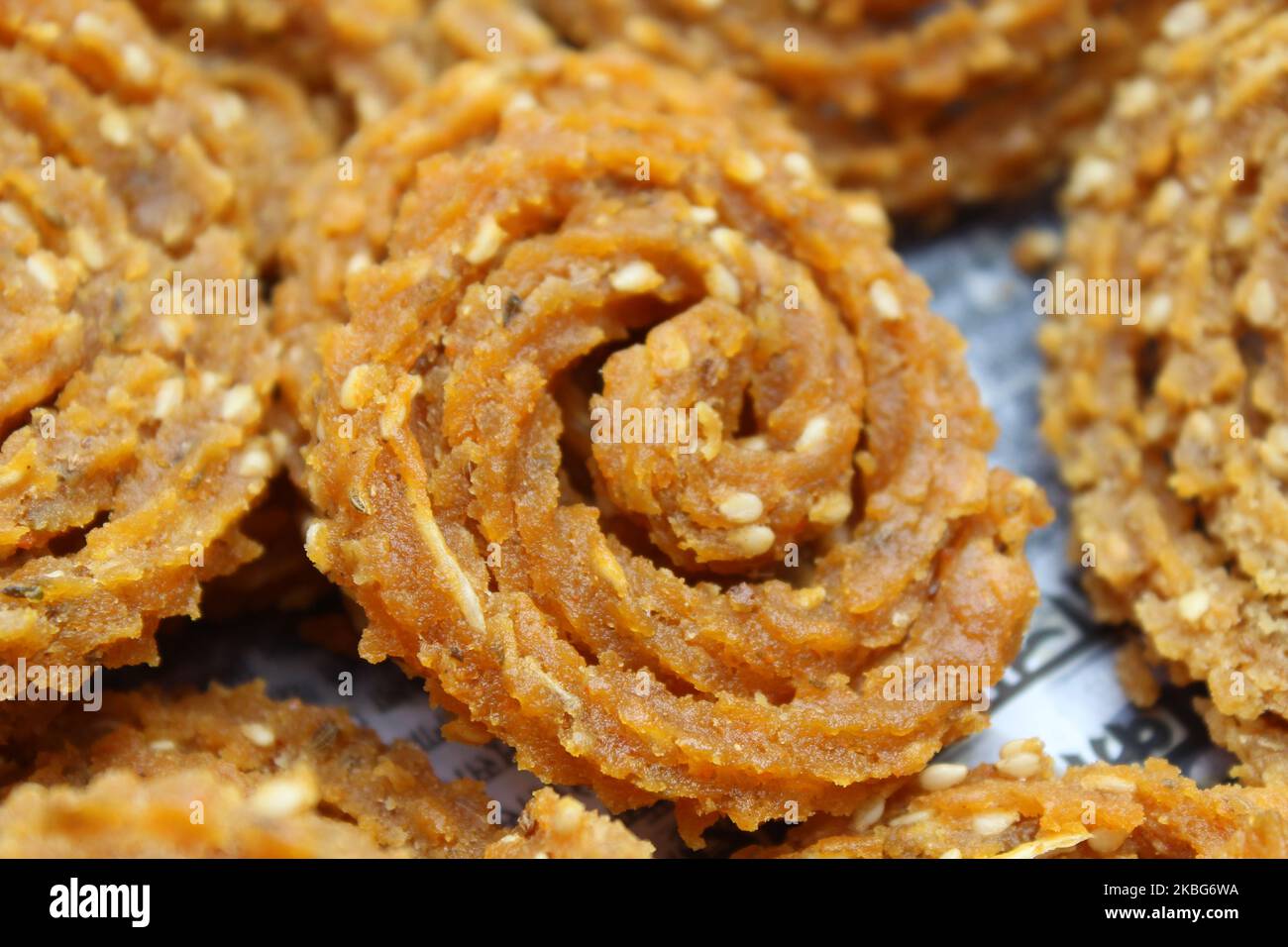 Raw chakali in plate. Indian Traditional Tea Time Snack Chakli, a deep ...