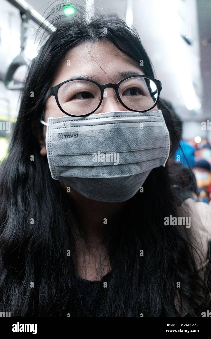 Taipei City Woman wearing a chirurgical protection mask to protect ...
