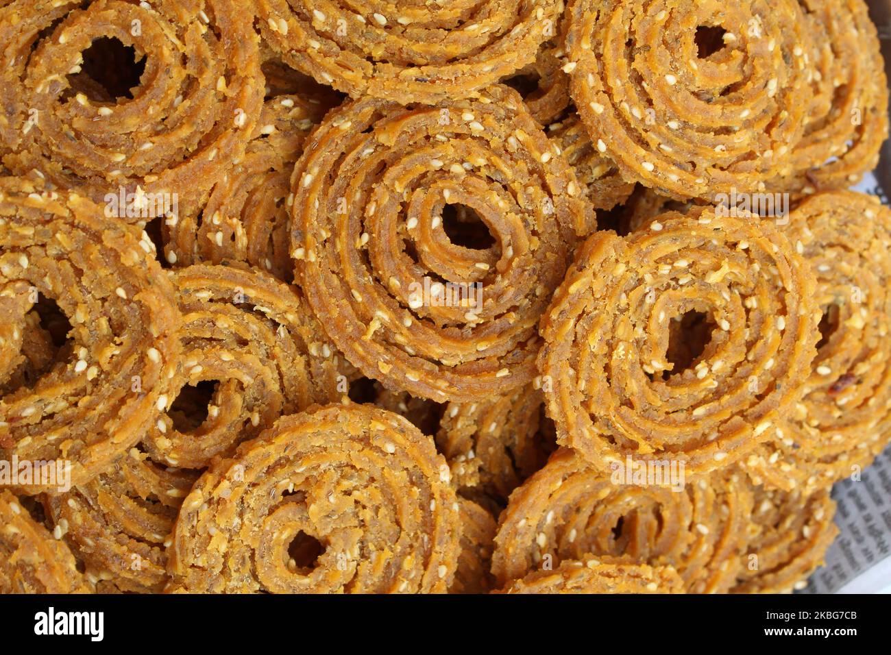 Raw chakali in plate. Indian Traditional Tea Time Snack Chakli, a deep ...