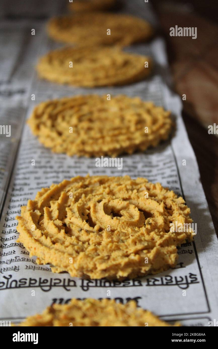 Raw chakali in plate. Indian Traditional Tea Time Snack Chakli, a deep ...