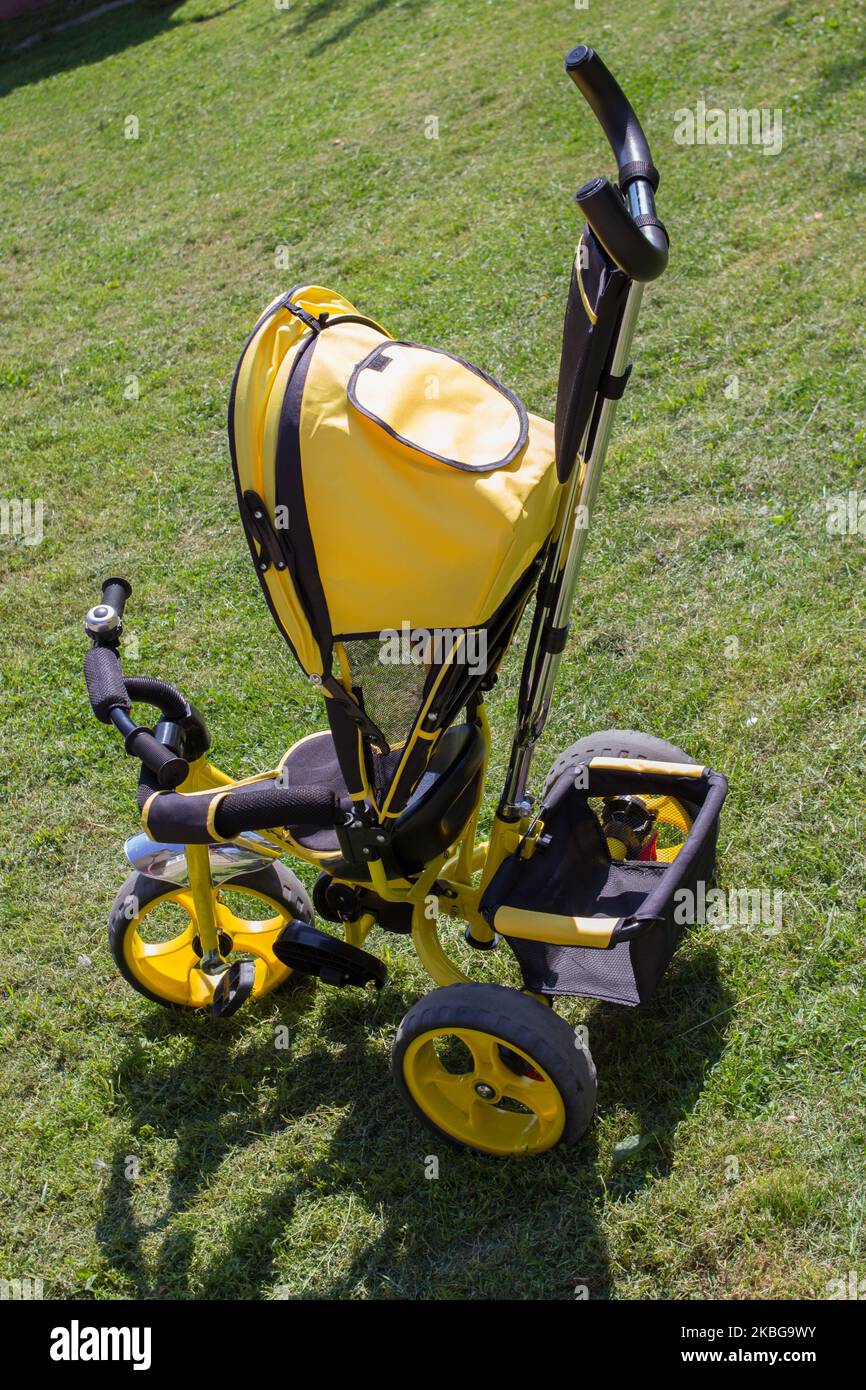 Three children on bike hi-res stock photography and images - Alamy