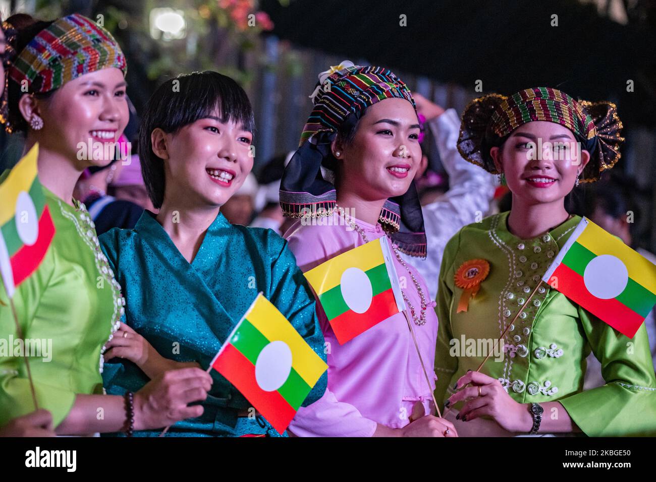 Shan ethnic women in traditional attire poses for photograph during a ...