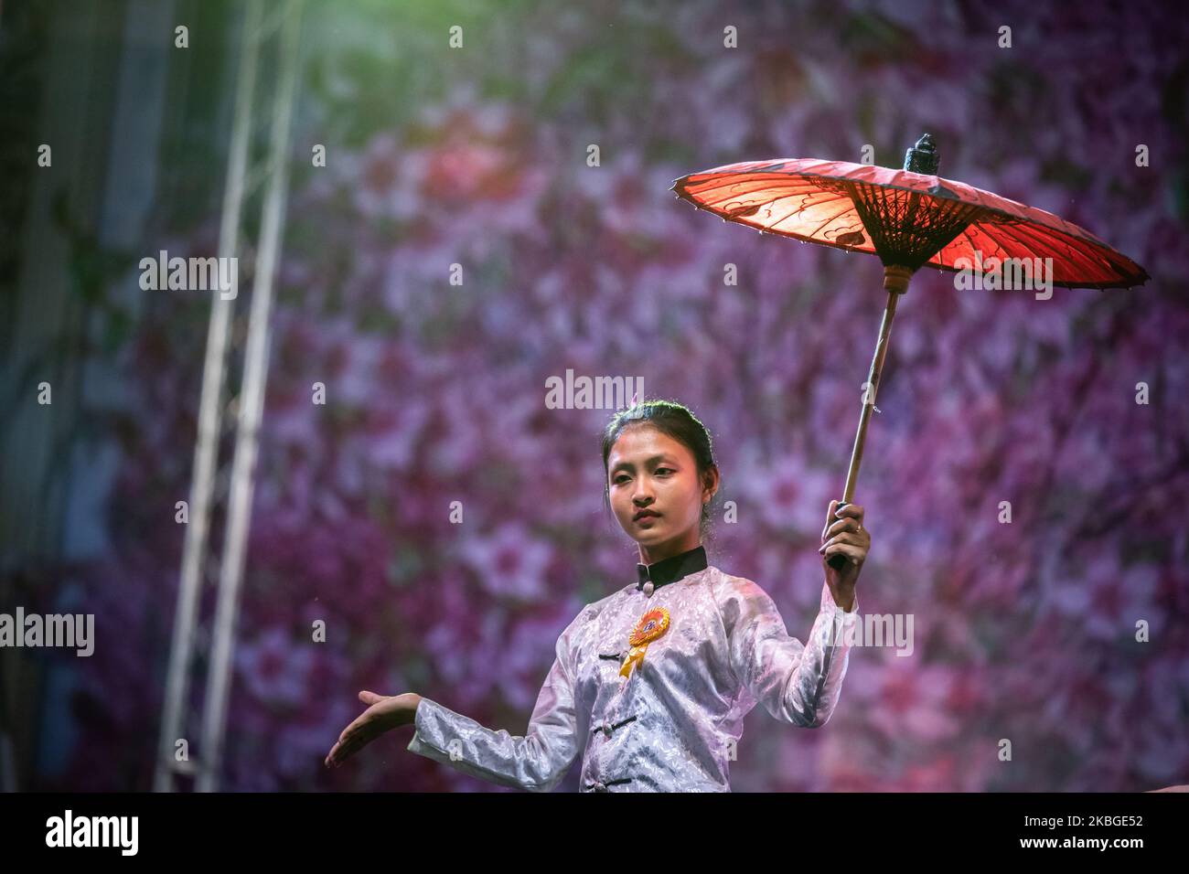 Shan ethnic woman in traditional attire perform on stage during a ...