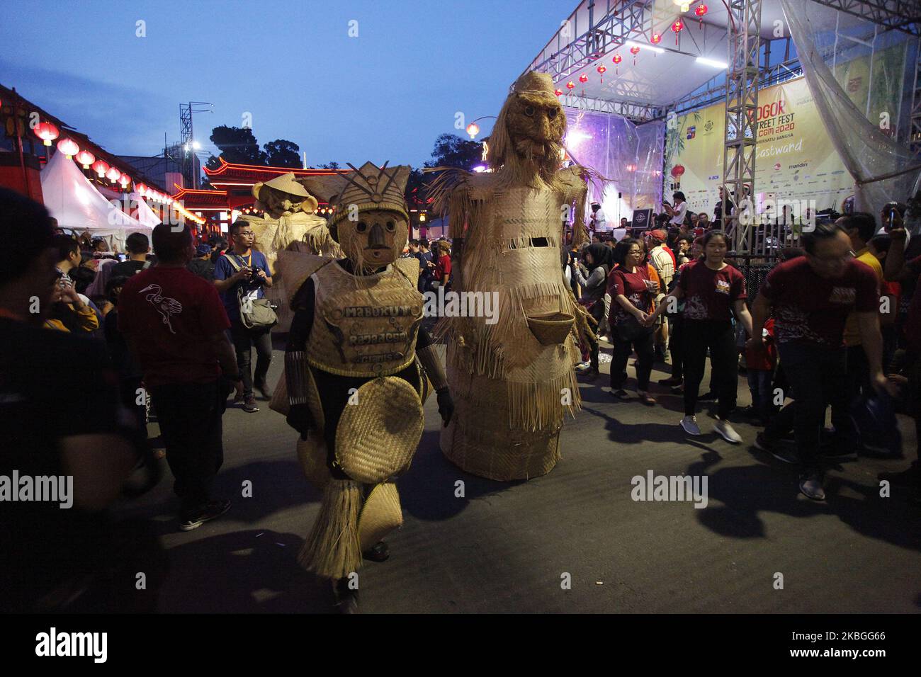 Participants seen performing with a bamboo puppets during the festival ...