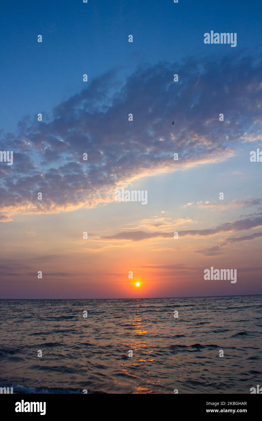 Early morning, sunrise over sea beautiful photo vertical Stock Photo ...