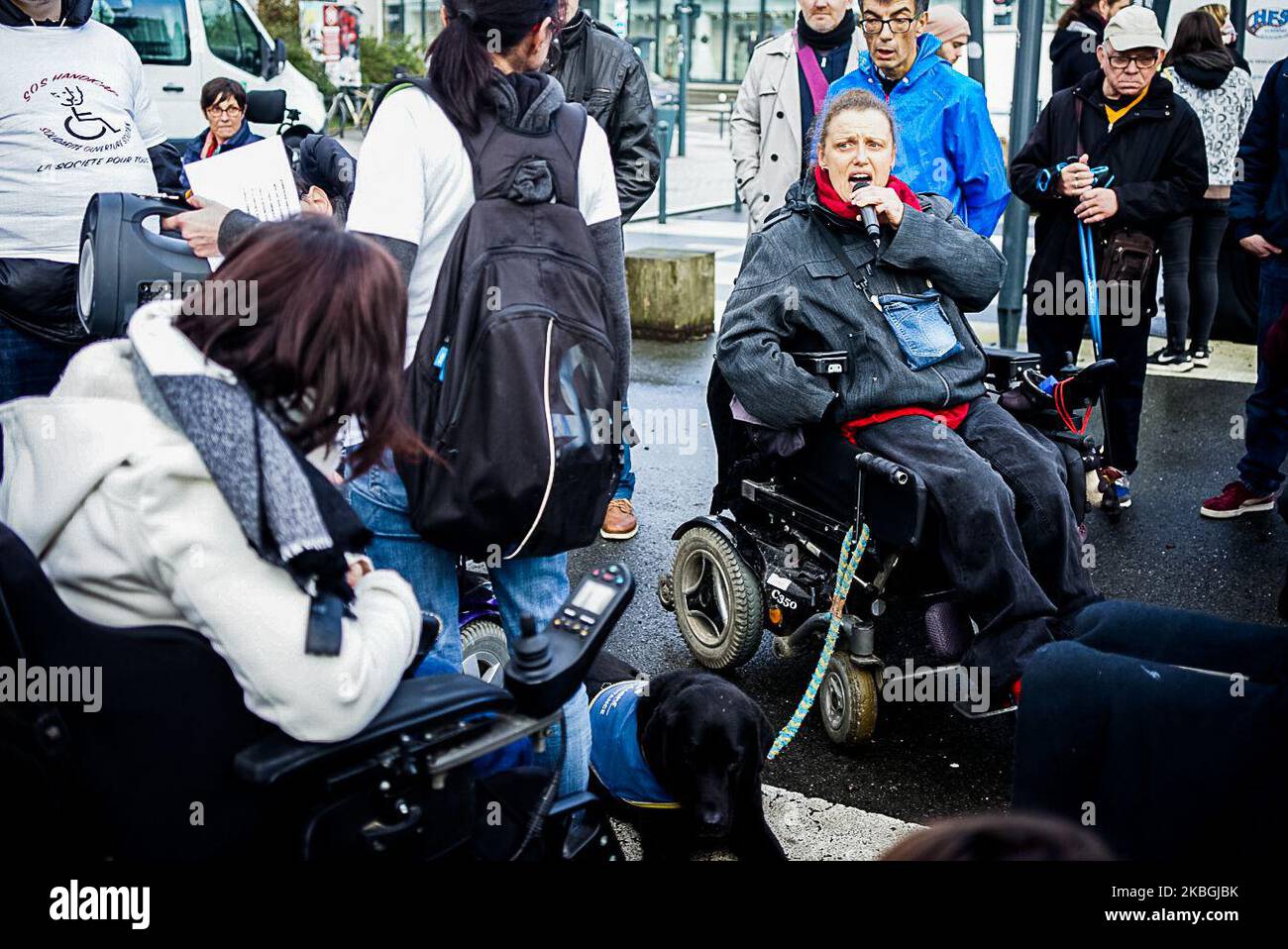 A person in a wheelchair demonstrates for greater inclusion of people ...