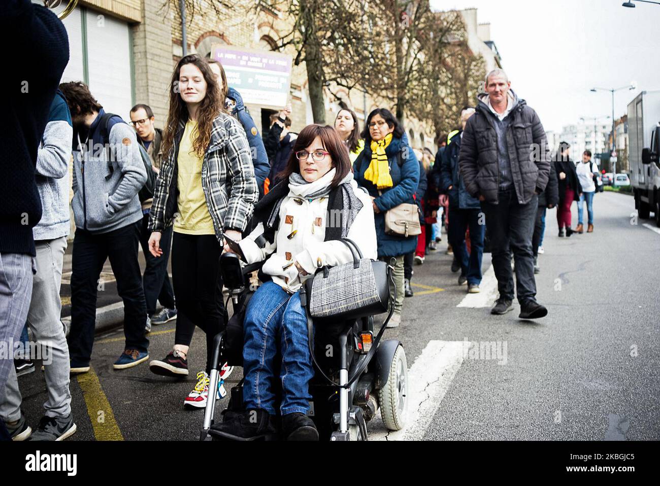 A person in a wheelchair demonstrates for greater inclusion of people ...